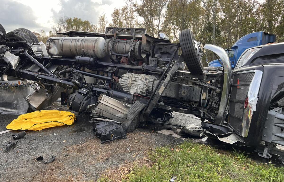Tractor trailer overturns, dumps load of drywall and backs up traffic ...